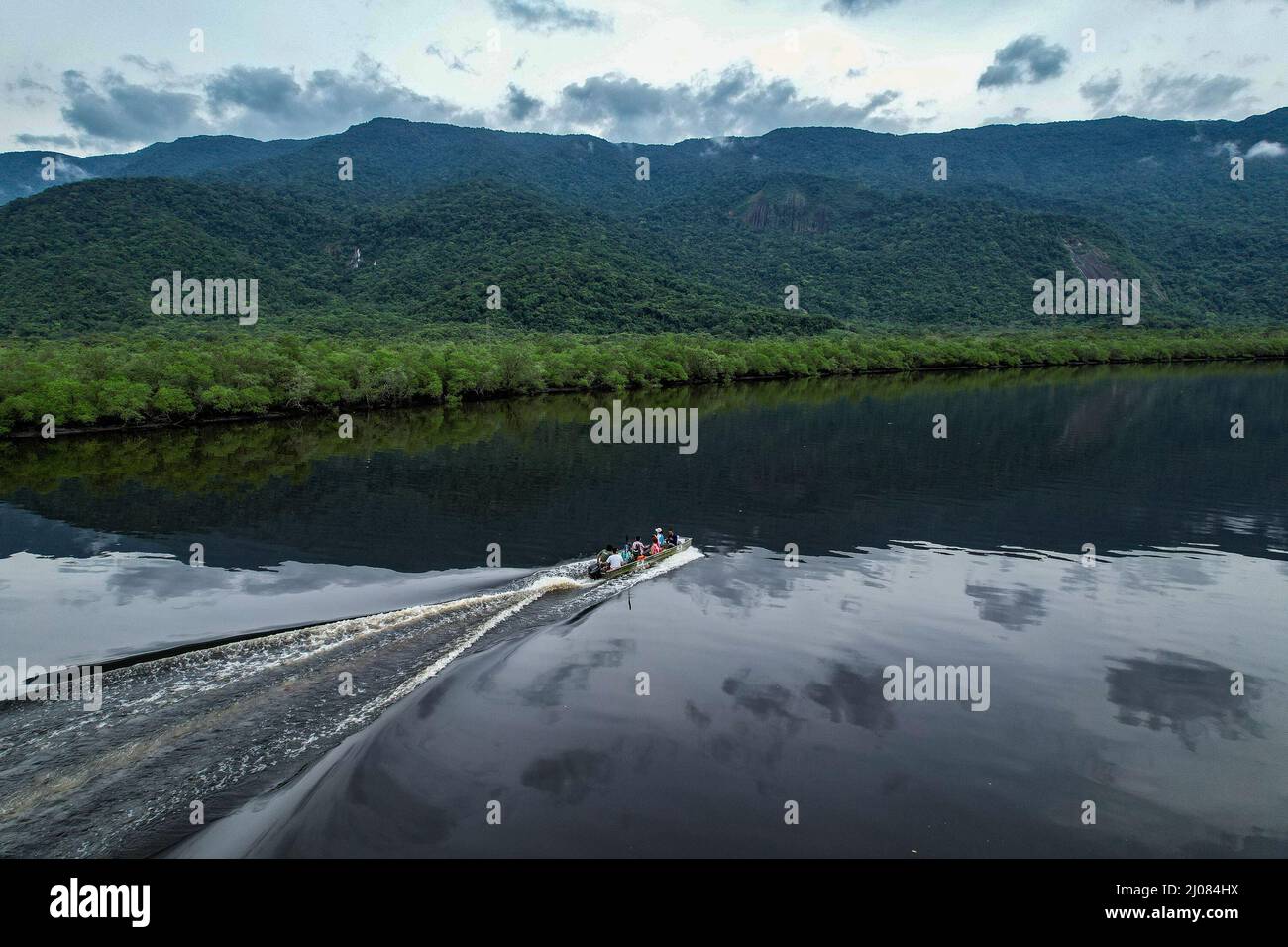 Bird's eye view to the boat leaving a water trail on the river Stock ...