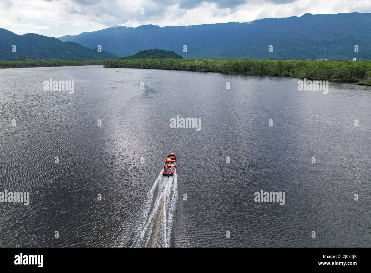 Bird's eye view to the boat leaving a water trail on the river Stock ...