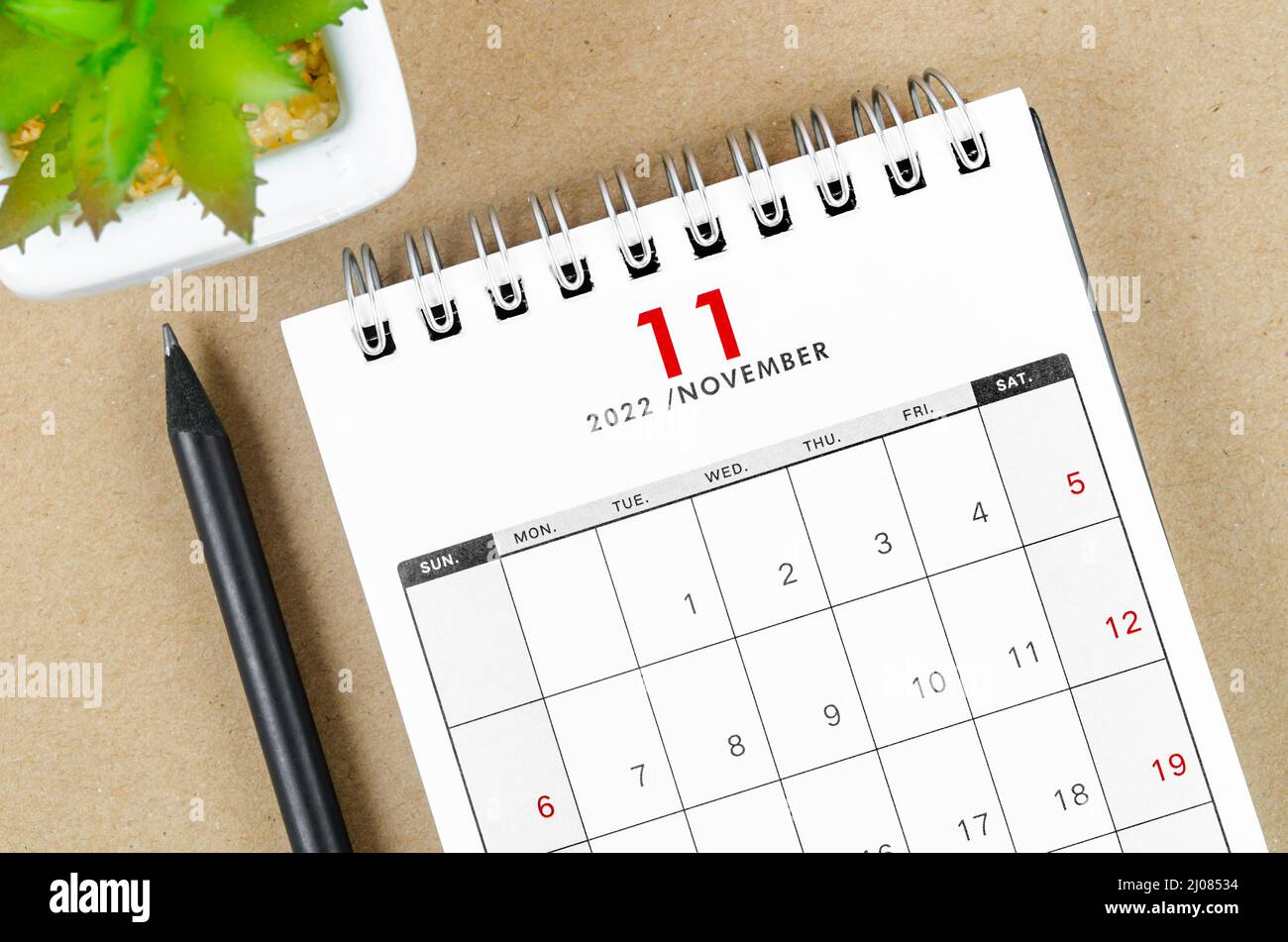 The November 2022 desk calendar on brown background Stock Photo - Alamy