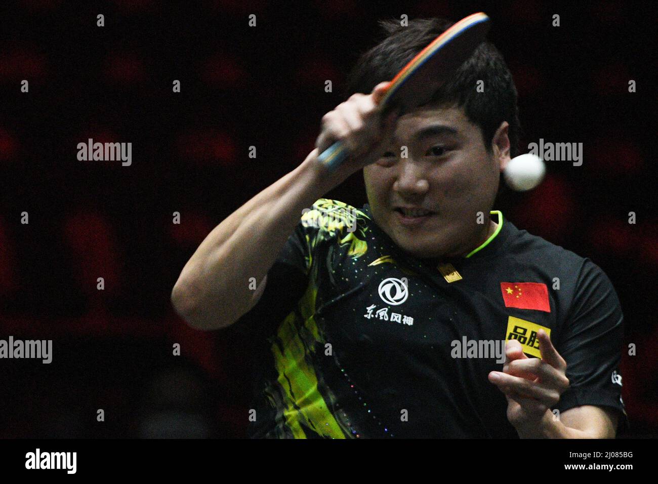 SINGAPORE, March 17, 2022 (Xinhua) -- Liang Jingkun of China hits a ...