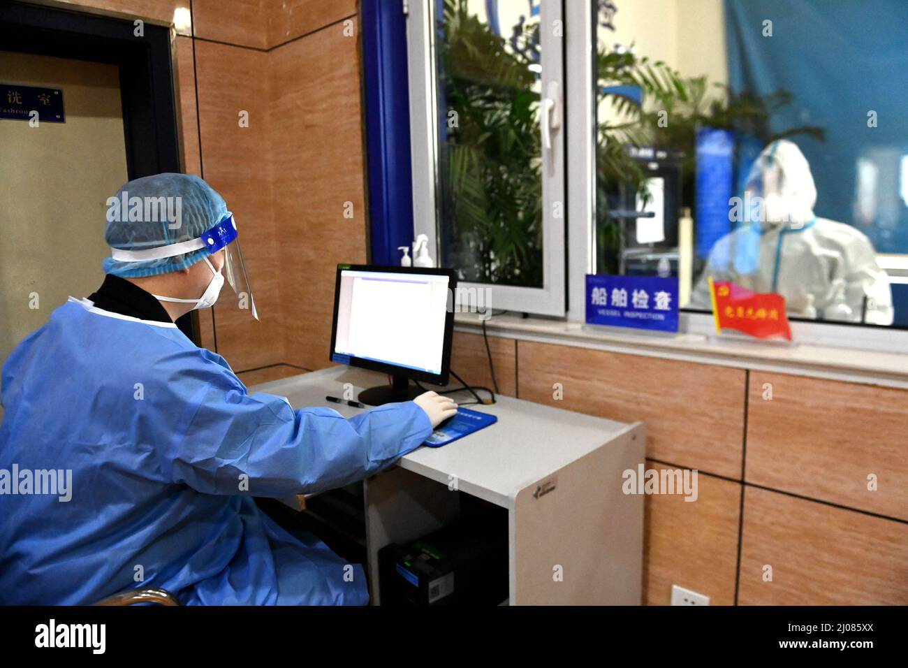 QINGDAO, CHINA - MARCH 17, 2022 - A policeman on duty at huangdao Entry ...
