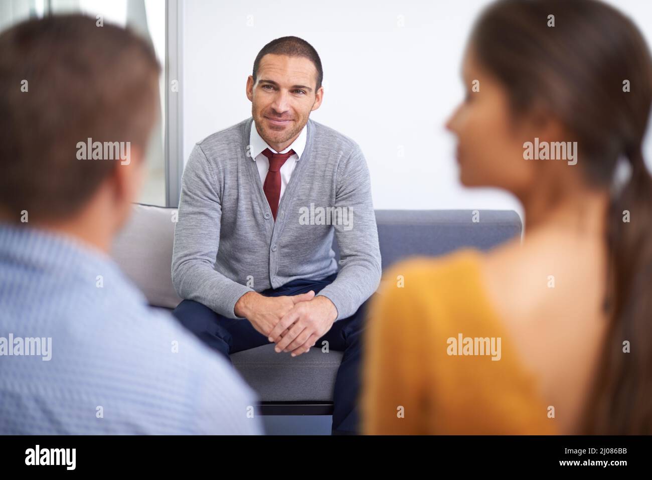 An exciting job interview. An attractive businessman being interviewed ...
