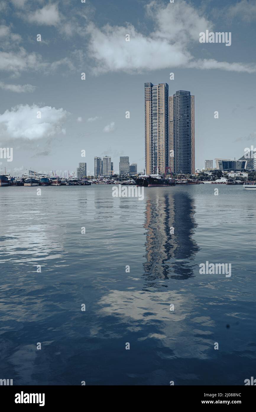 High-rise buildings with the reflection on the water Stock Photo - Alamy