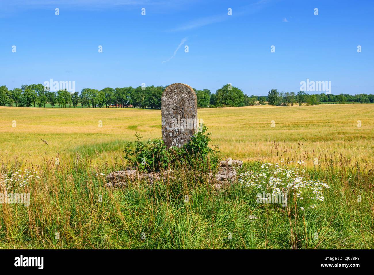 Old milestone in the countryside Stock Photo - Alamy