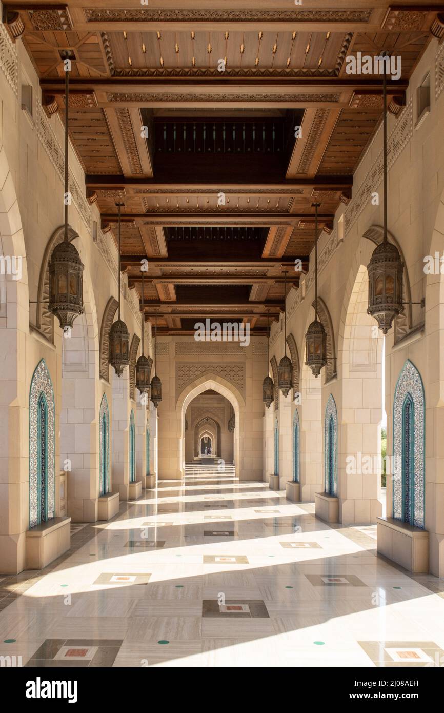 View of the arched hallway of Sultan Qaboos Grand Mosque in Muscat ...