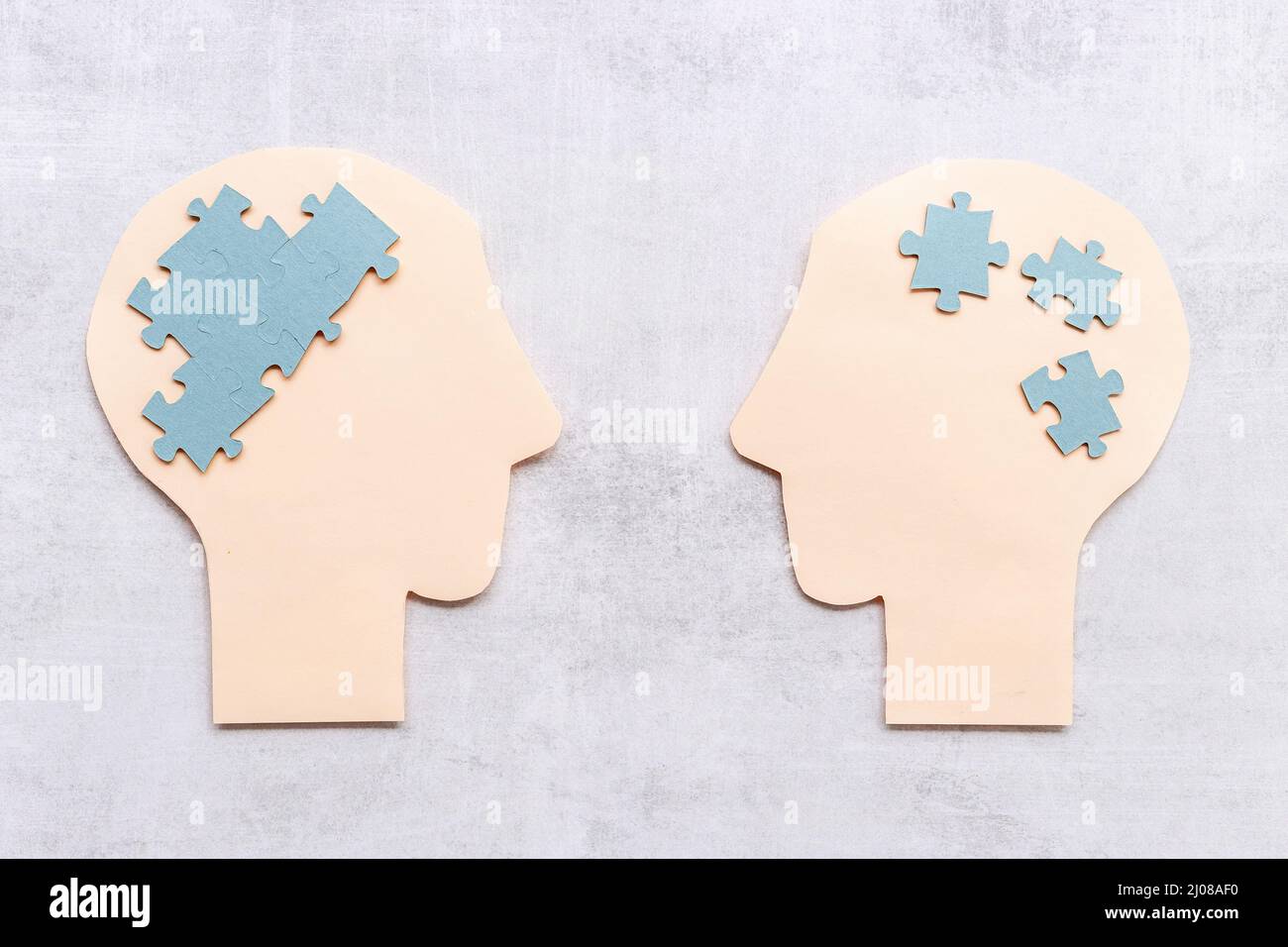 Brain puzzles on two human heads. Communication and connection concept ...