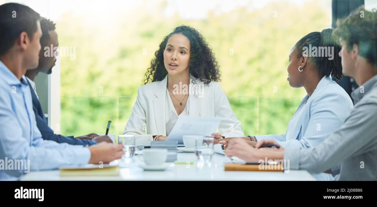 I really want your input. Shot of a team of staff having a business ...