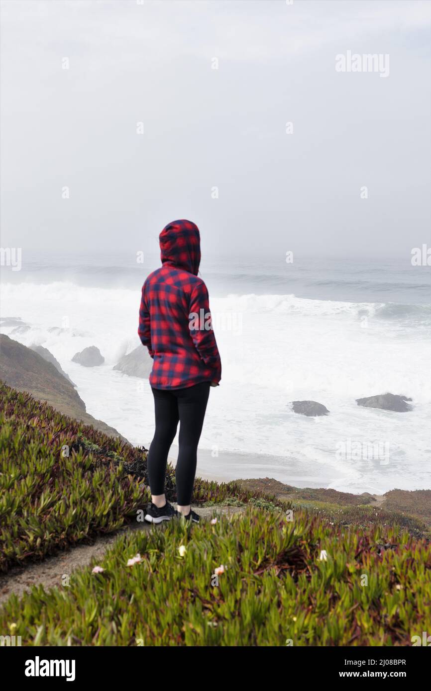 Sad Girl Standing On Cliff