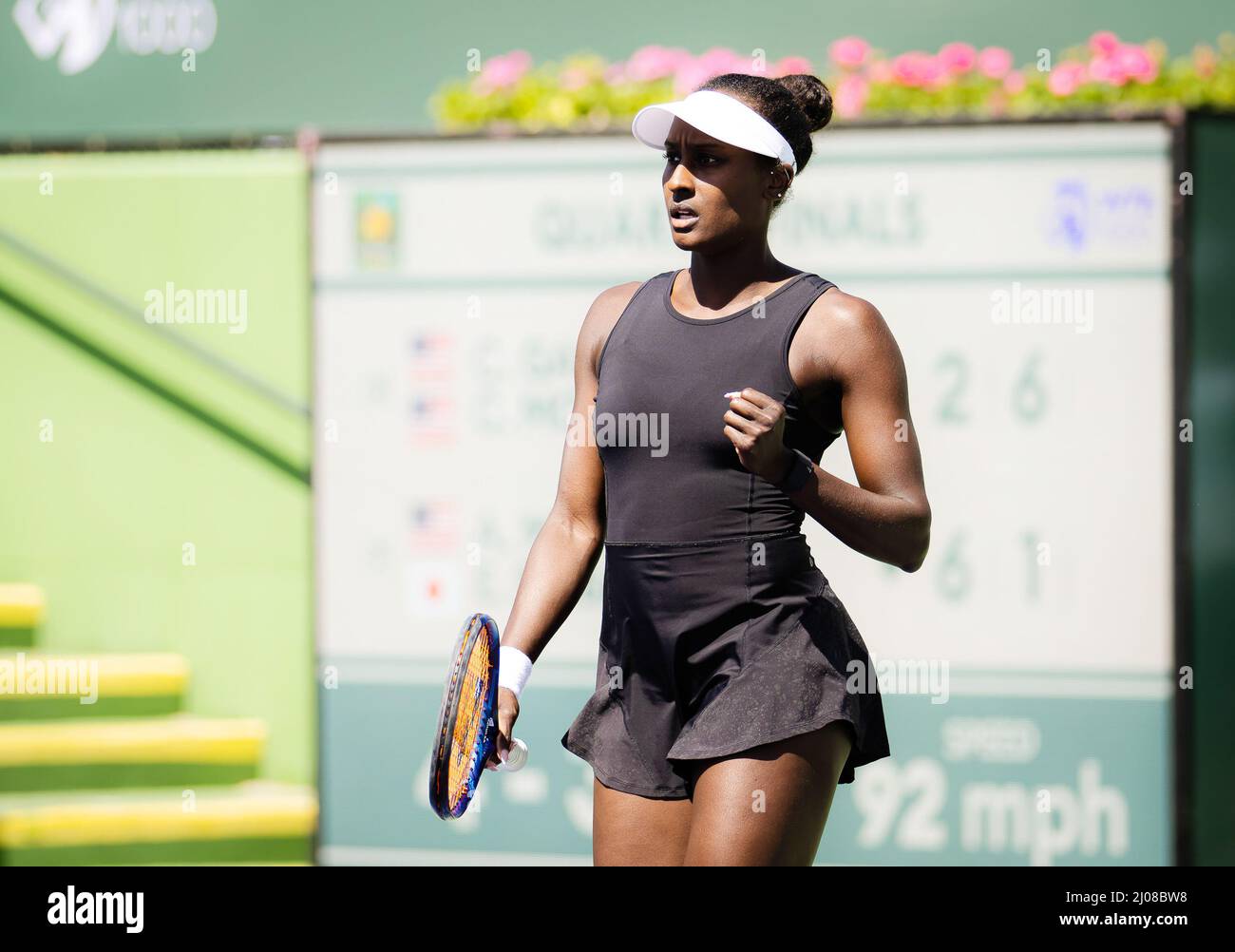 Asia Muhammad of the United States playing doubles at the 2022 BNP ...