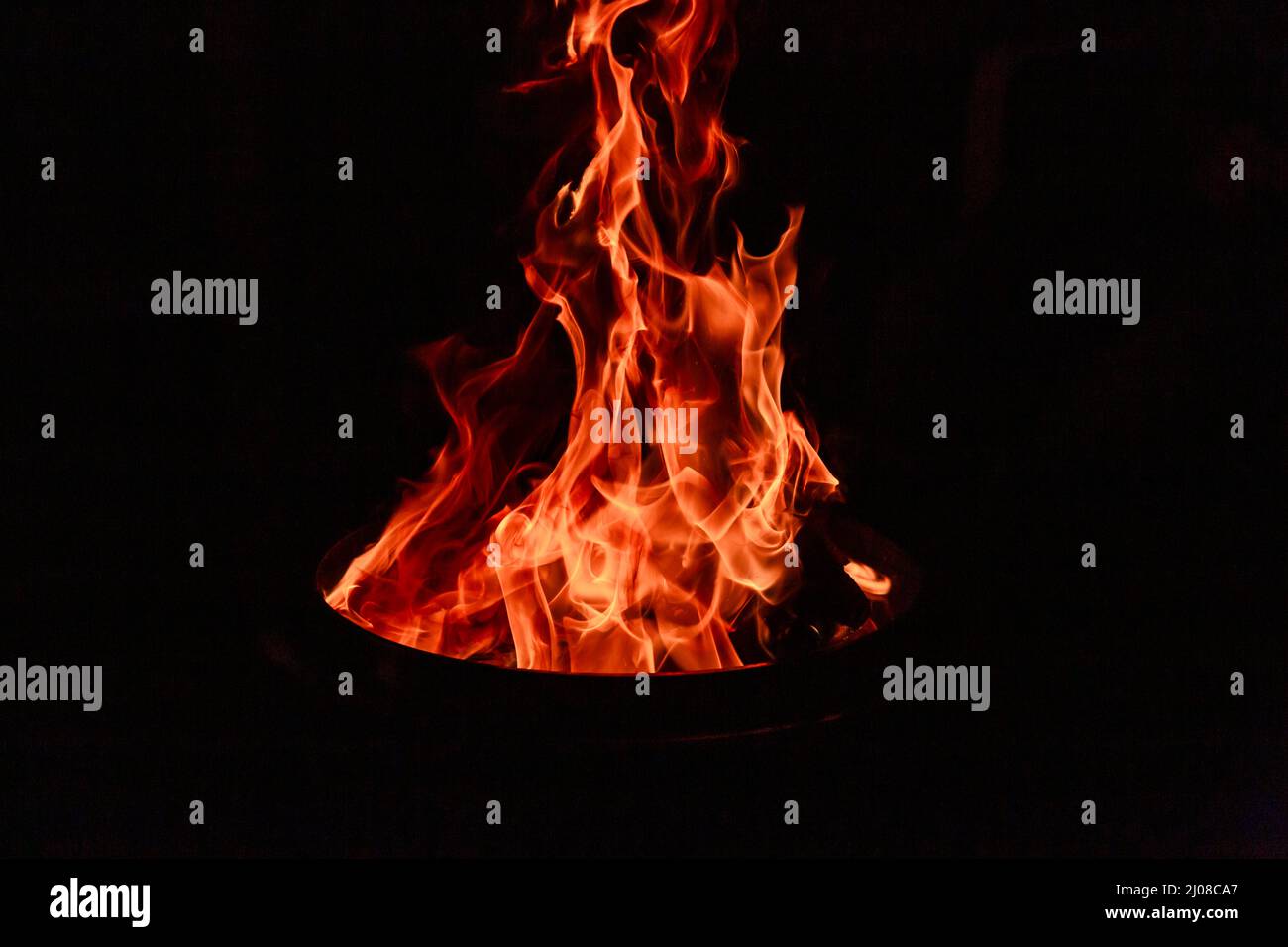 intense flame with a black background Stock Photo - Alamy