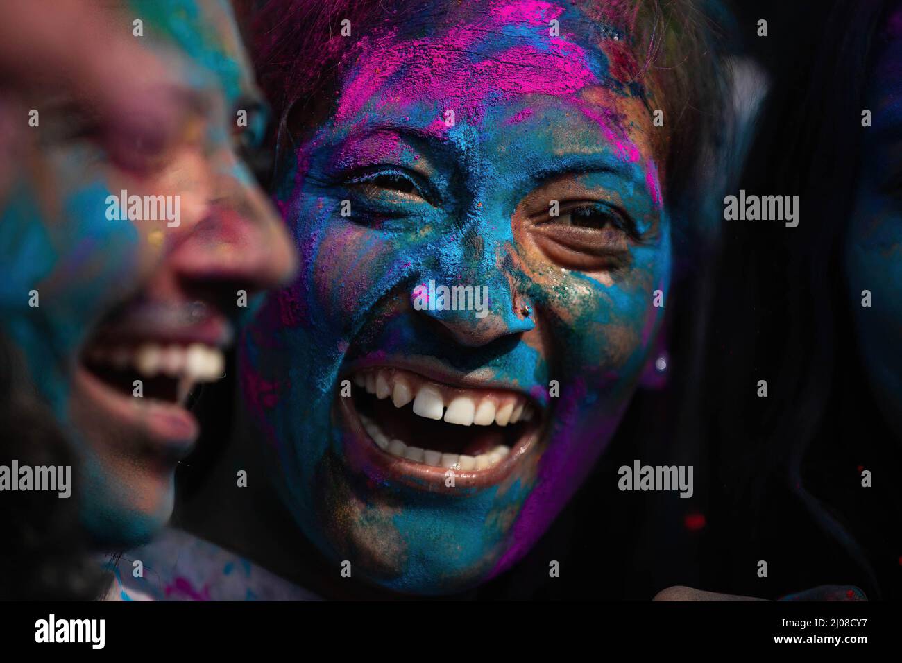 Kathmandu, Nepal. 25th Mar, 2022. A woman's face smeared with vermilion ...