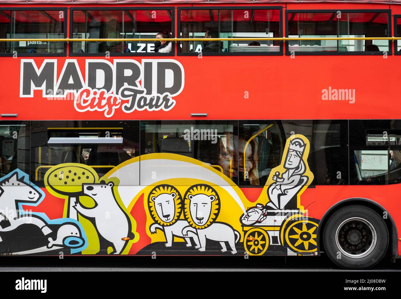 Tourists ride the touristic Madrid City tour double-decker bus in Spain ...