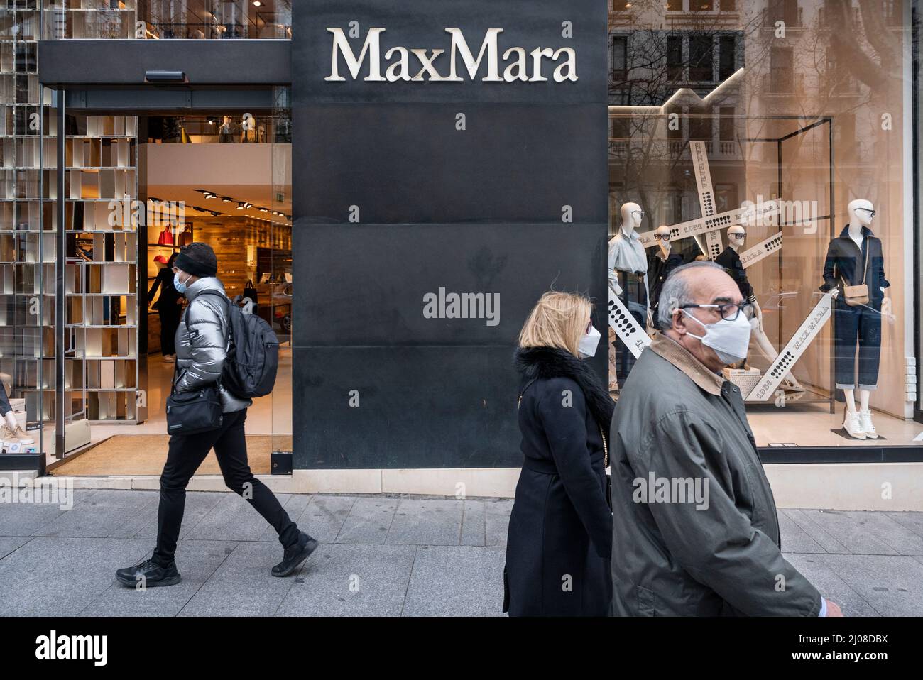 Pedestrians walk past the Italian fashion brand Max Mara store seen in ...