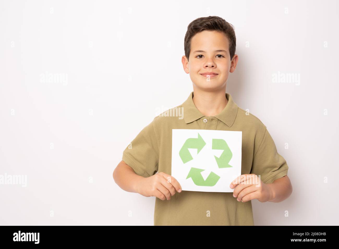 Little boy holding recycle symbol standing isolated over white ...