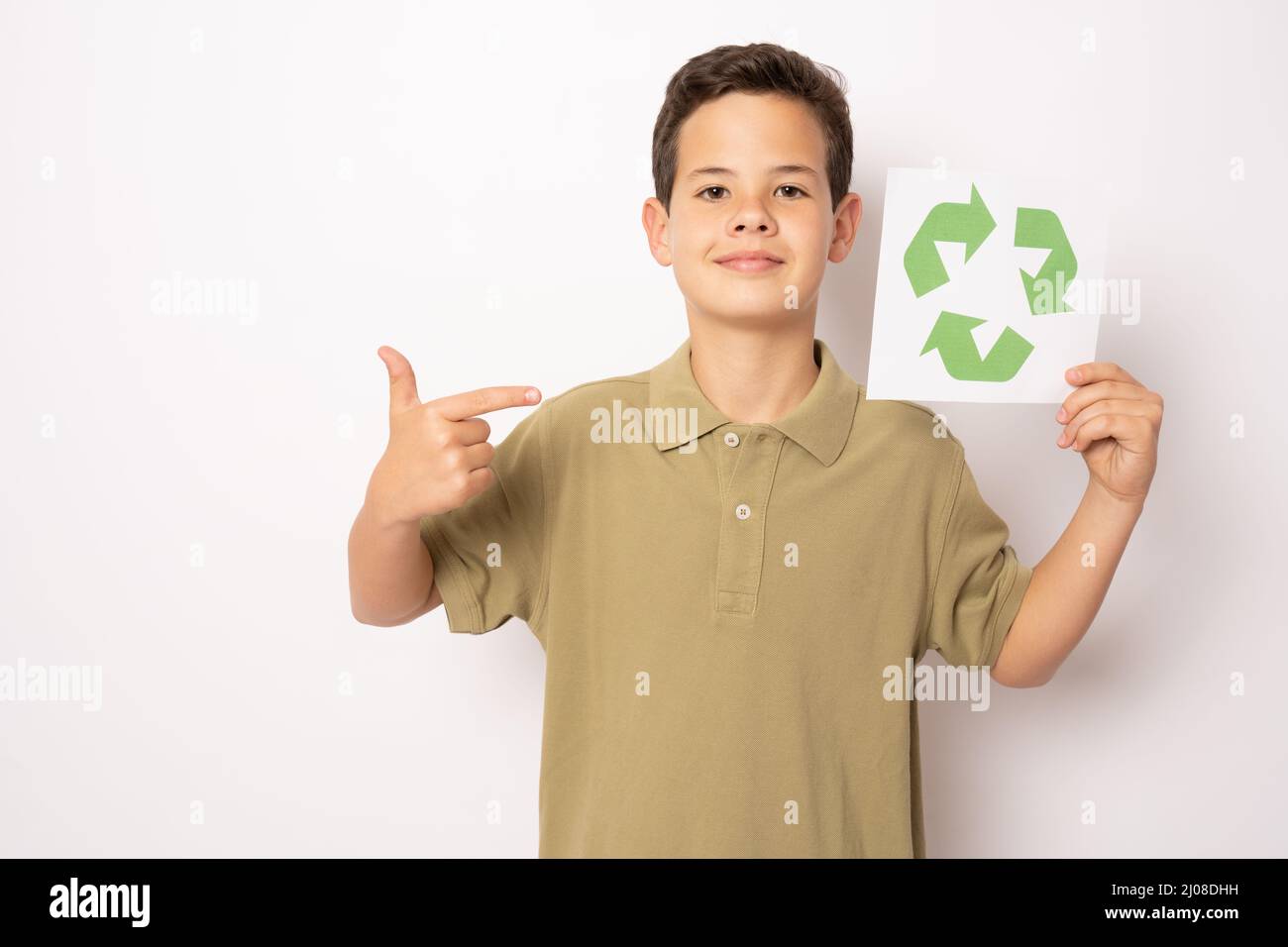 Little boy holding recycle symbol standing isolated over white ...