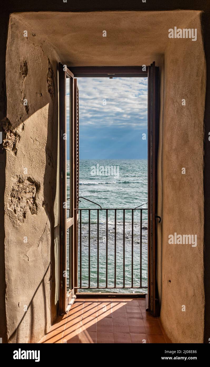 The window on the sea. A window of an old palace or castle overlooking ...