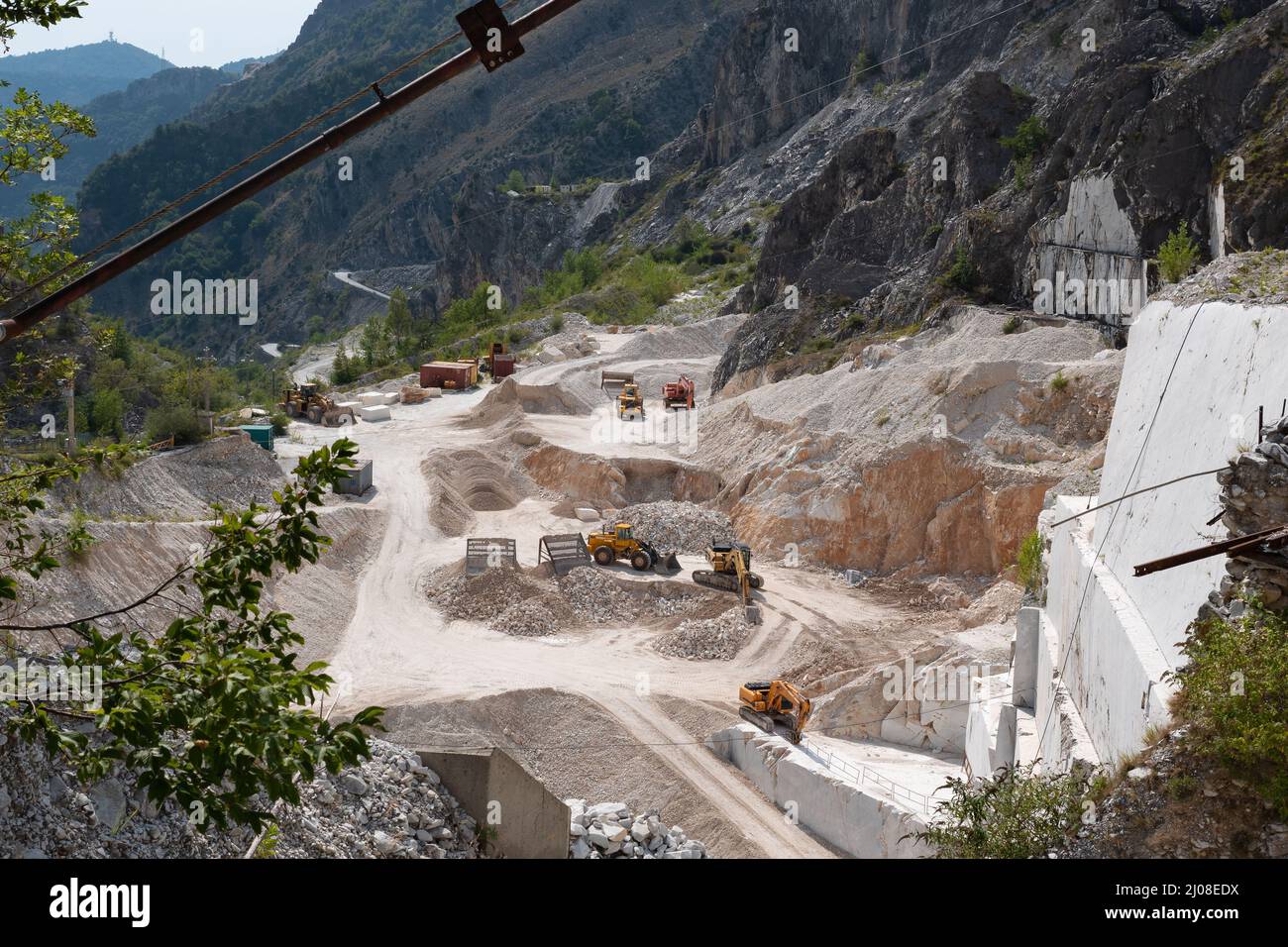 View of the Carrara Marble Quarries with Excavation Vehicles ready for ... View of the Carrara Marble Quarries with Excavation Vehicles ready for ...