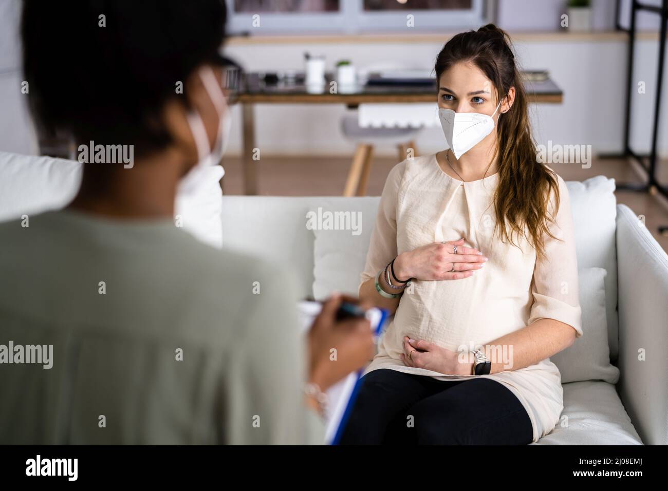 Doula Care And Pregnant Woman Patient At Home Stock Photo - Alamy