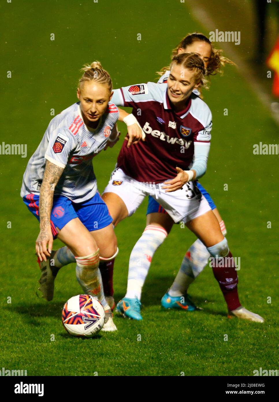 DAGENHAM, ENGLAND - MARCH 16: L-R Leah Galton of Manchester United ...