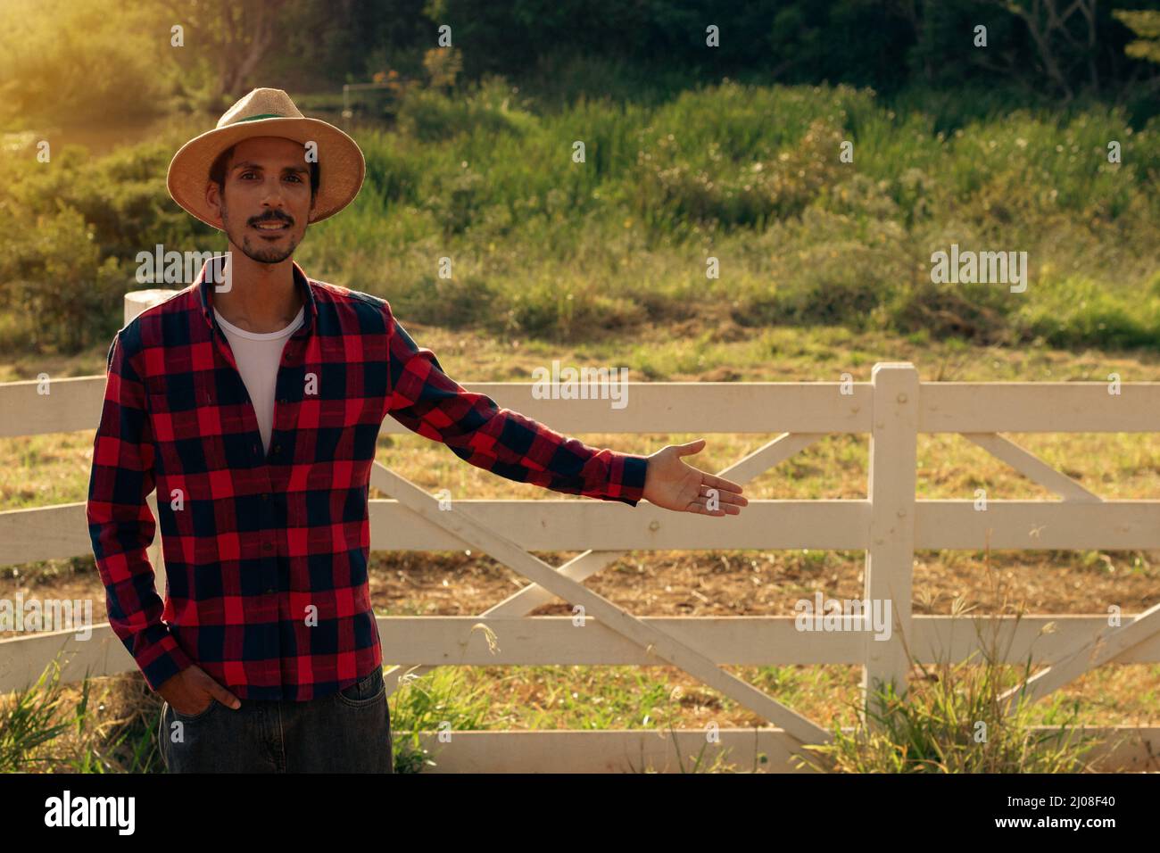 Male young black farmer pointing in farmland Stock Photo - Alamy
