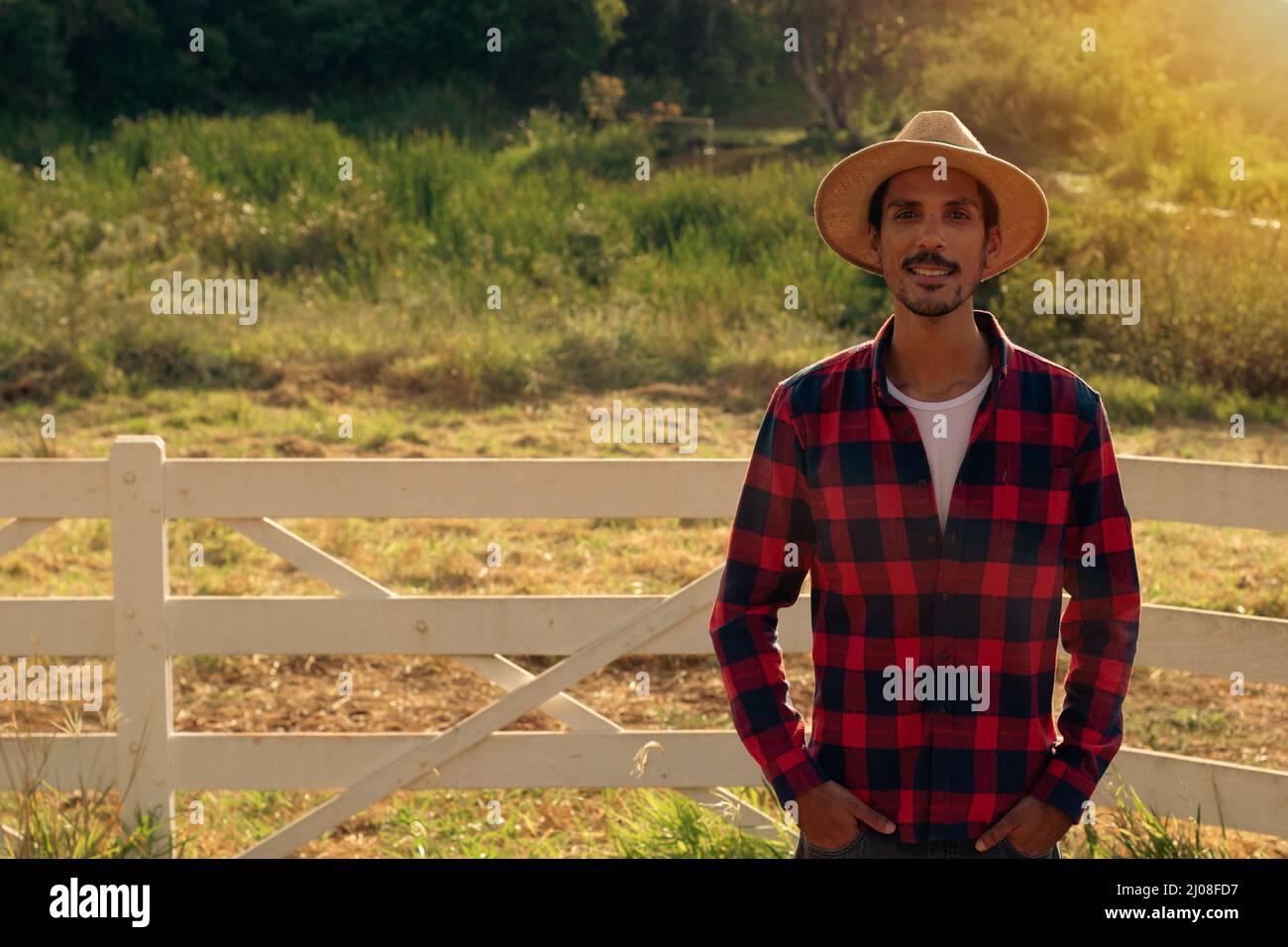 Male young black farmer working in front of the farmers gate Stock ...