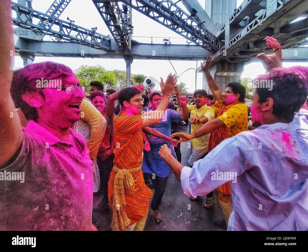 Devotees celebrate the festival of colors. Holi is a popular ancient ...