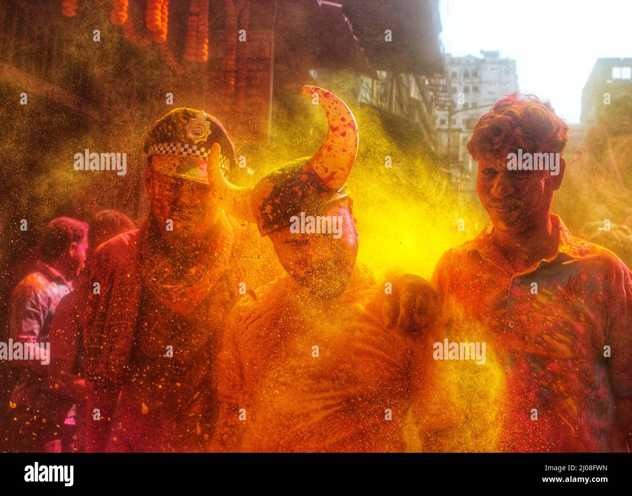 Devotees celebrate the festival of colors. Holi is a popular ancient ...