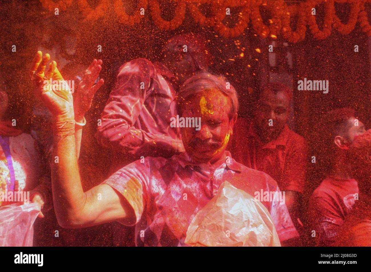 Devotees celebrate the festival of colors. Holi is a popular ancient ...