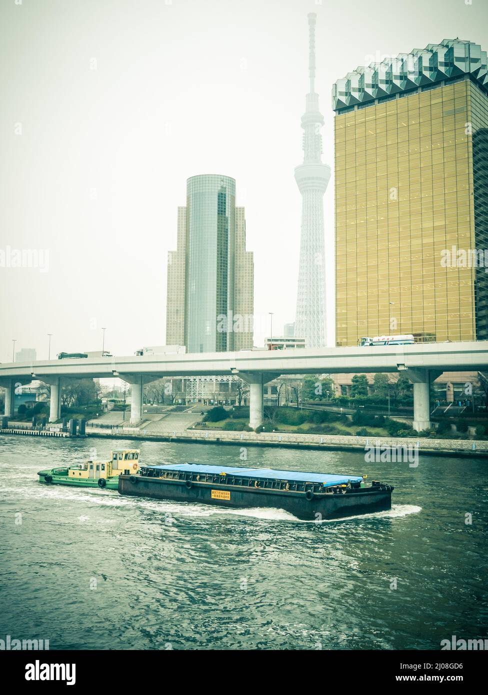 Tokyo Skytree tower and Asahi Beer Hall along the Sumida River in Tokyo ...