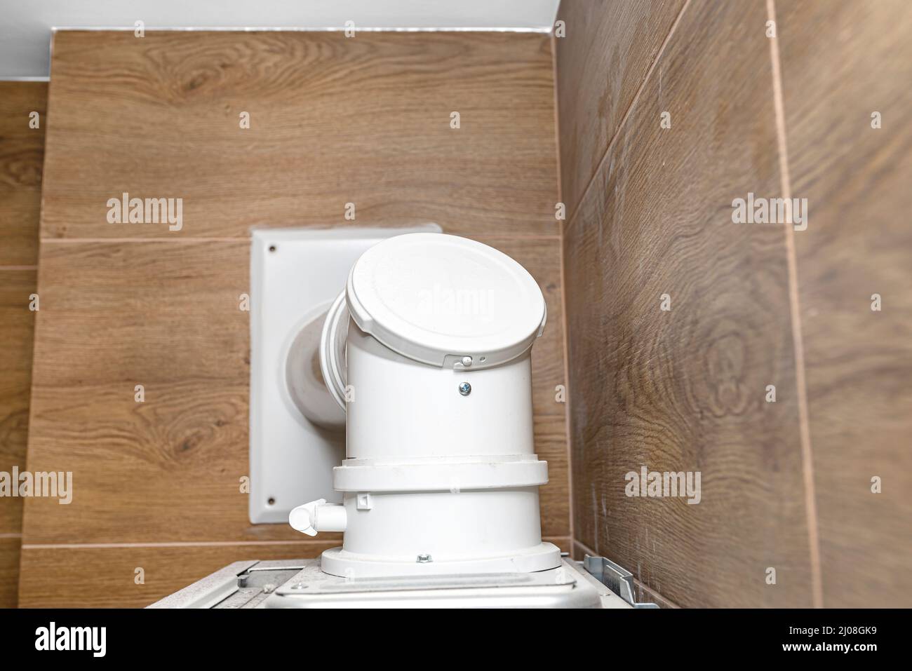 A modern gas boiler for natural gas, installed in a boiler room lined ...