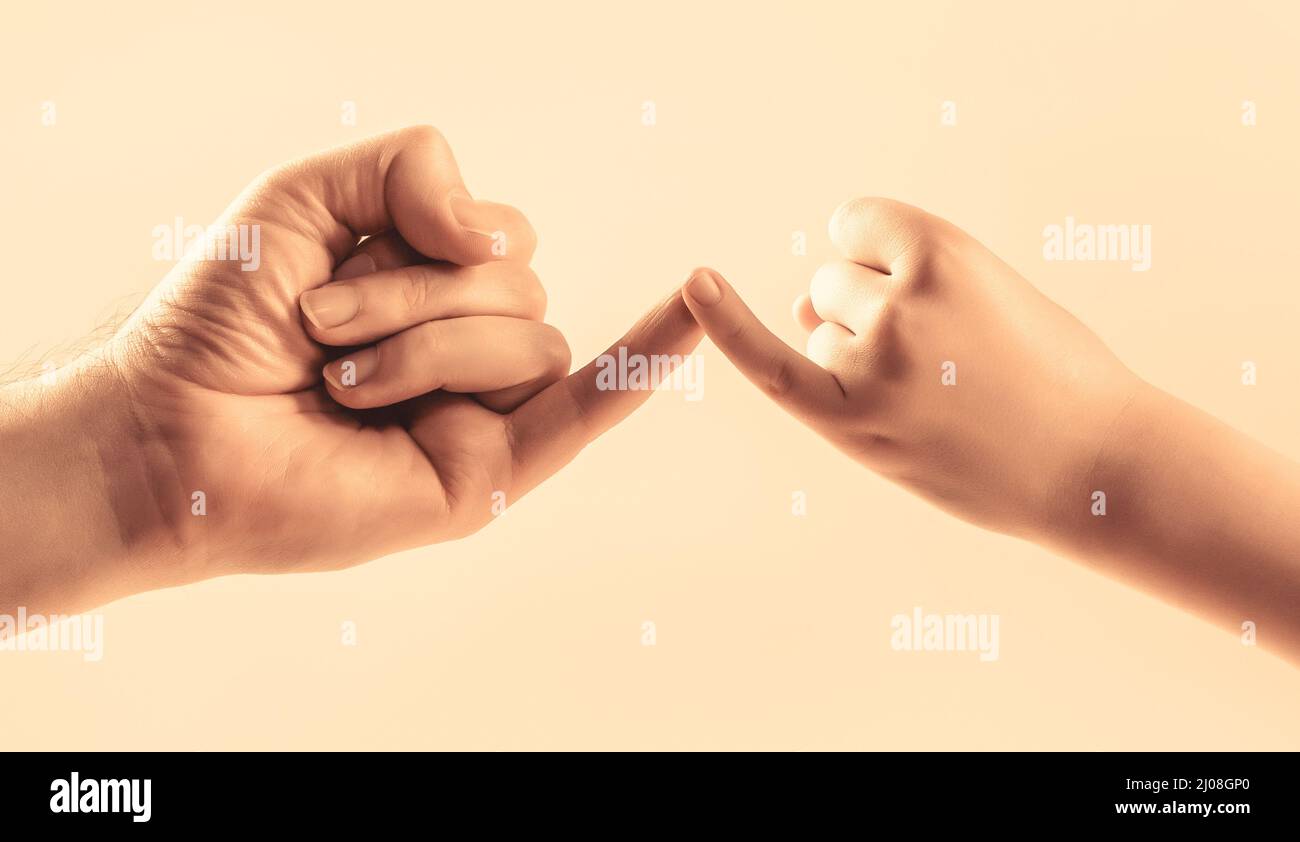 Friendship of generations. Father, daughter hand making promise ...