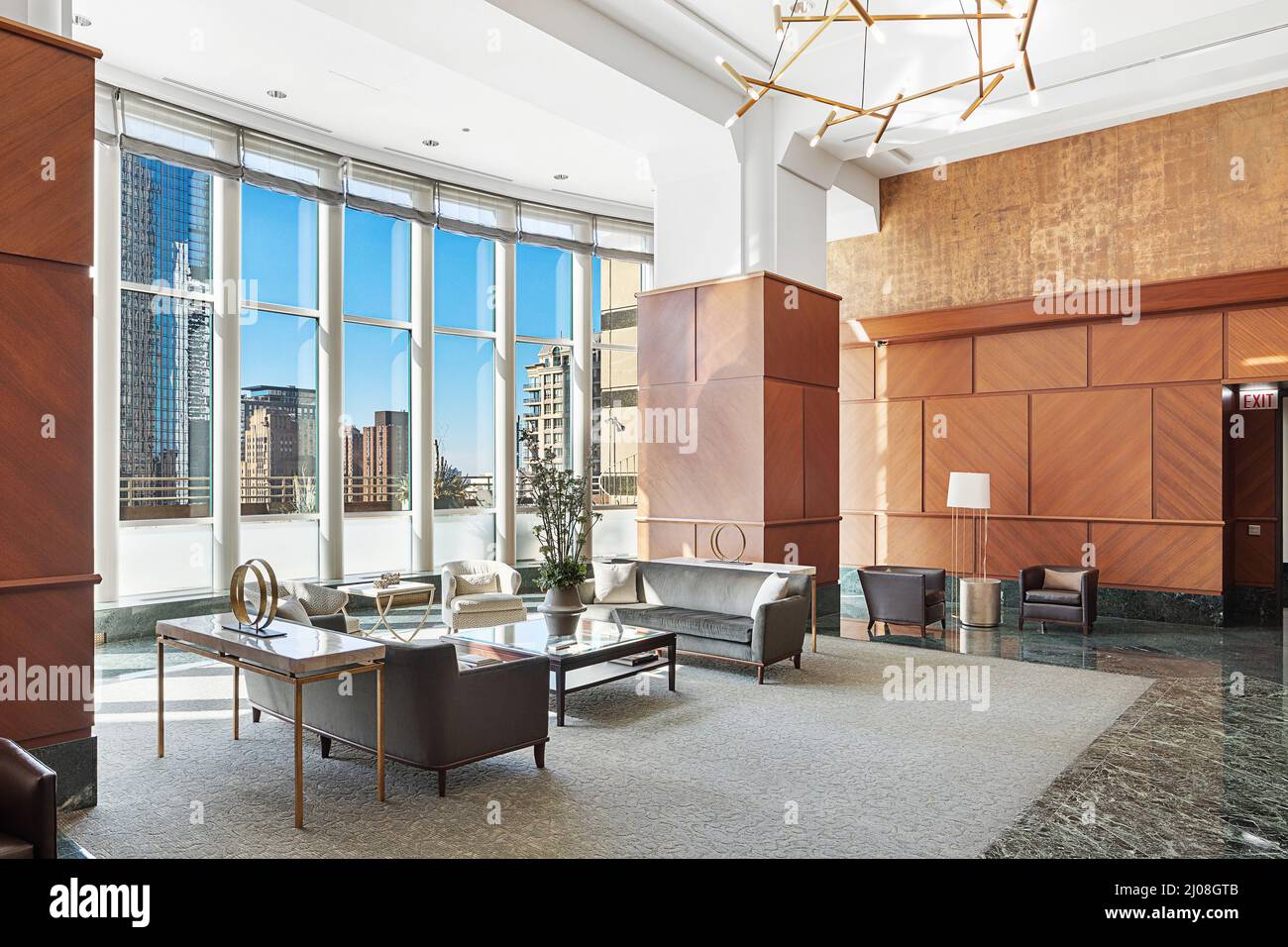 A high rise condominium lobby in downtown Chicago with cozy furniture ...