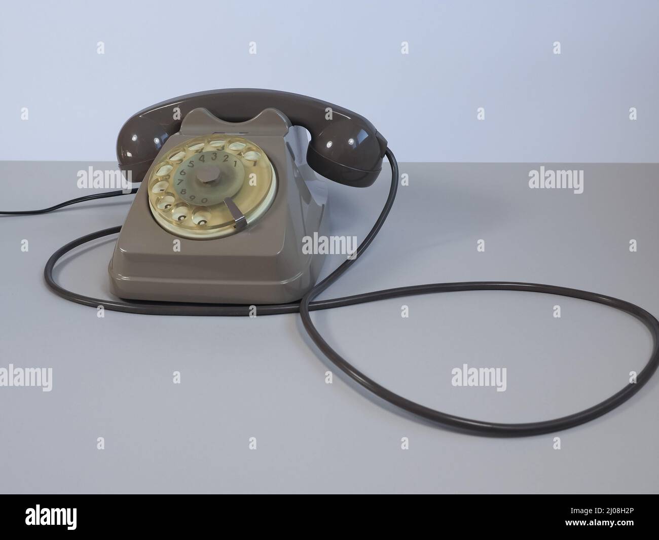 Vintage grey rotary dial analog landline telephone Stock Photo - Alamy