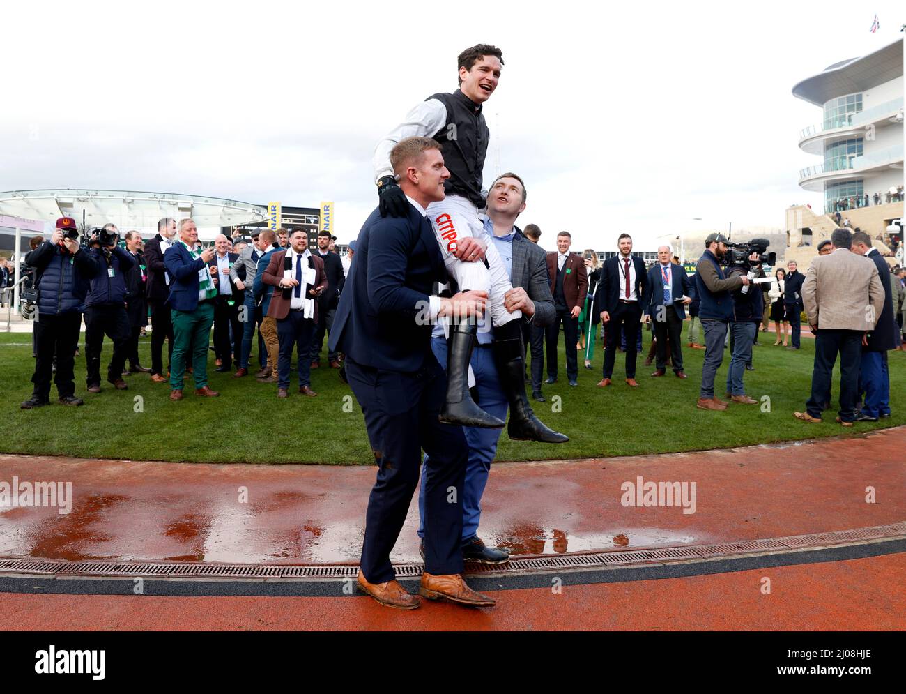 Jockey Danny Mullins is picked up as he celebrates winning the Paddy ...