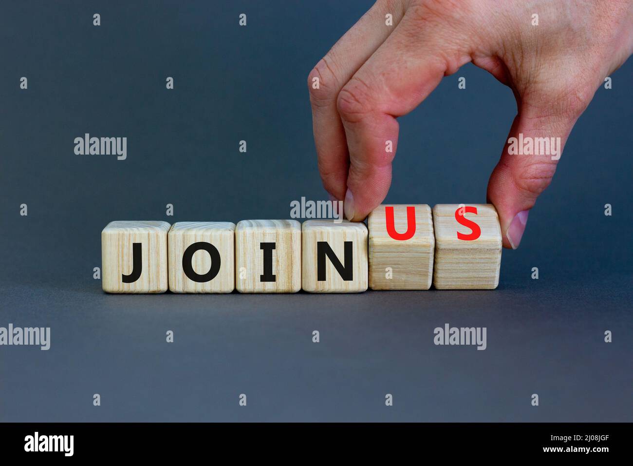 Join us symbol. Businessman turns wooden cubes and changes concept ...