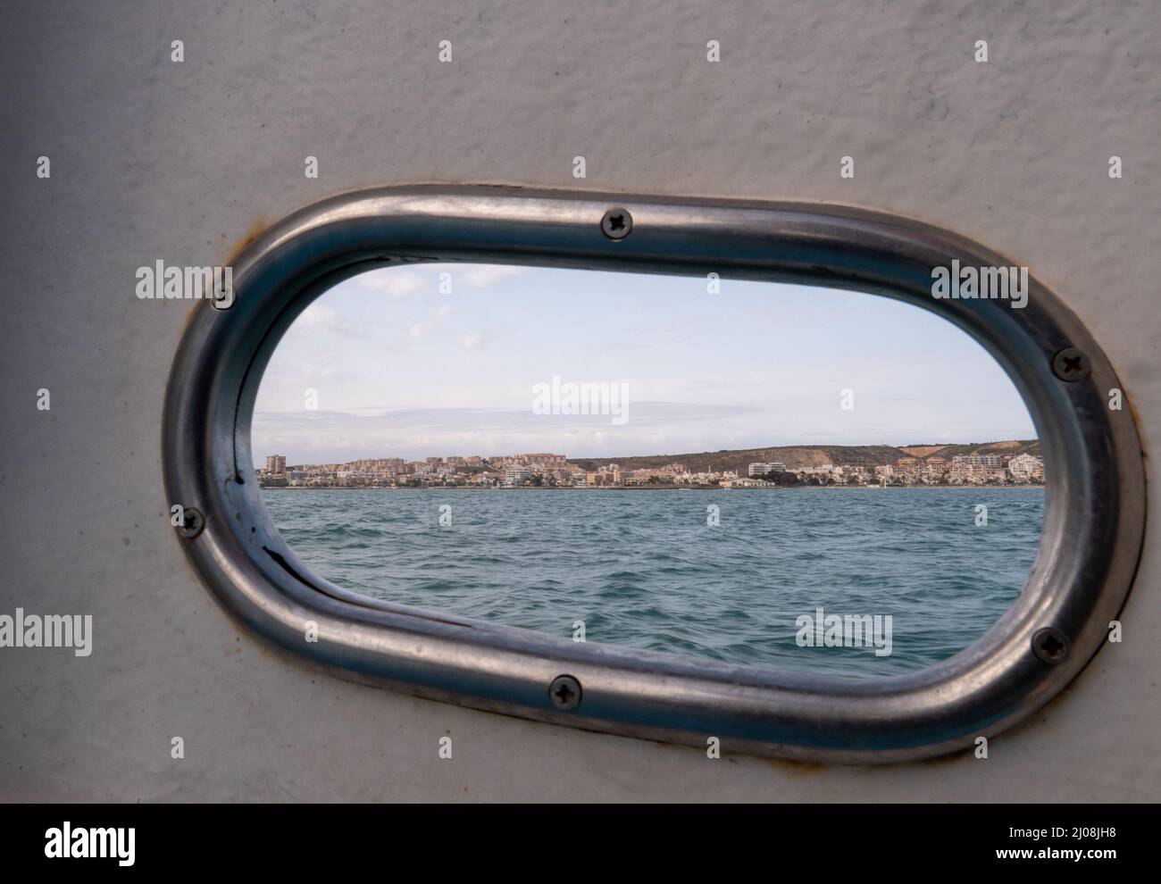 View of the sea visible from boat window Stock Photo - Alamy