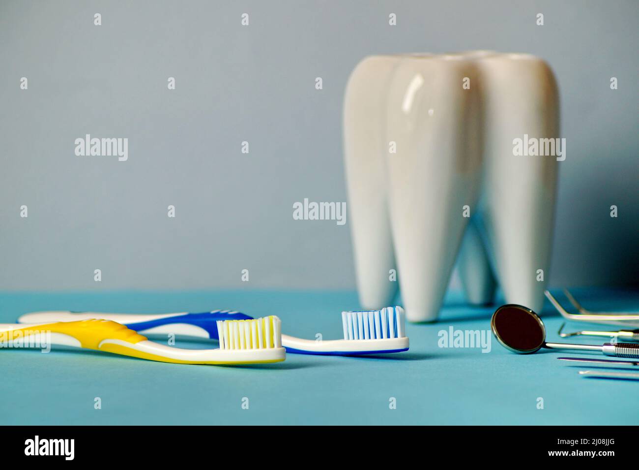 on the table in front of the tooth there are toothbrushes and devices ...
