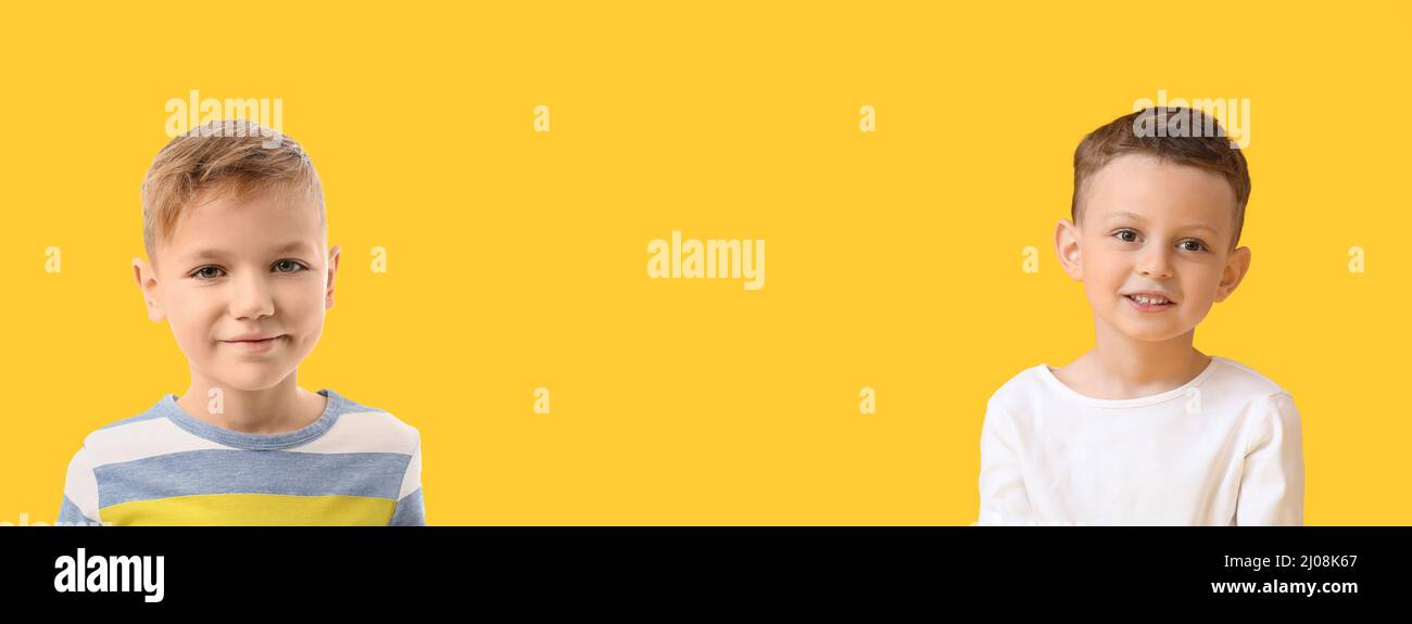 Happy little boys on yellow background with space for text Stock Photo ...