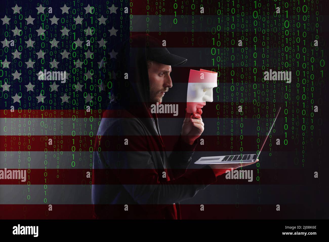 American hacker with laptop on dark background Stock Photo - Alamy