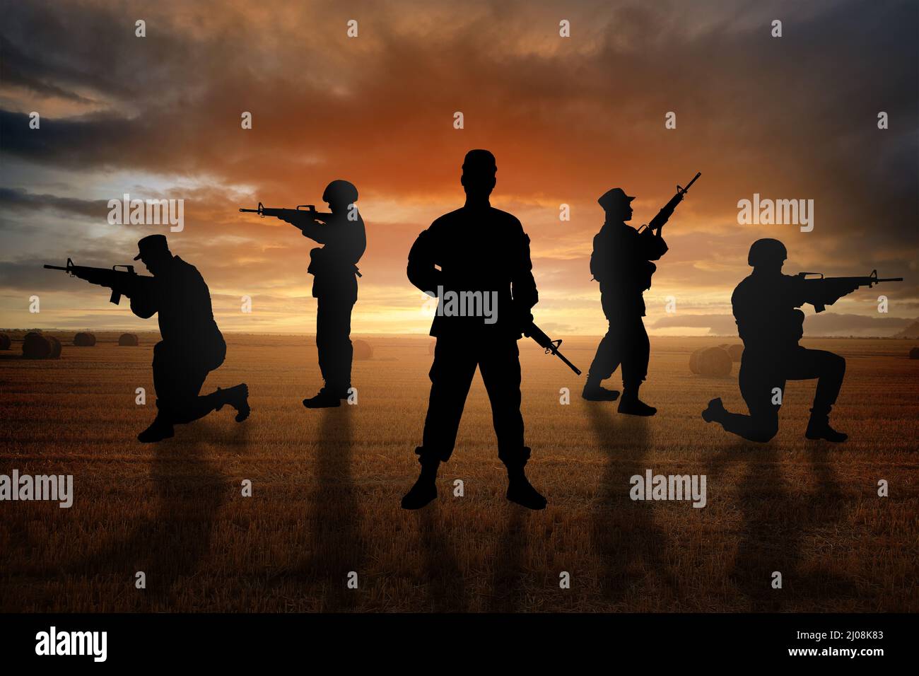 Silhouettes of soldiers in field at sunset. War in Ukraine Stock Photo ...