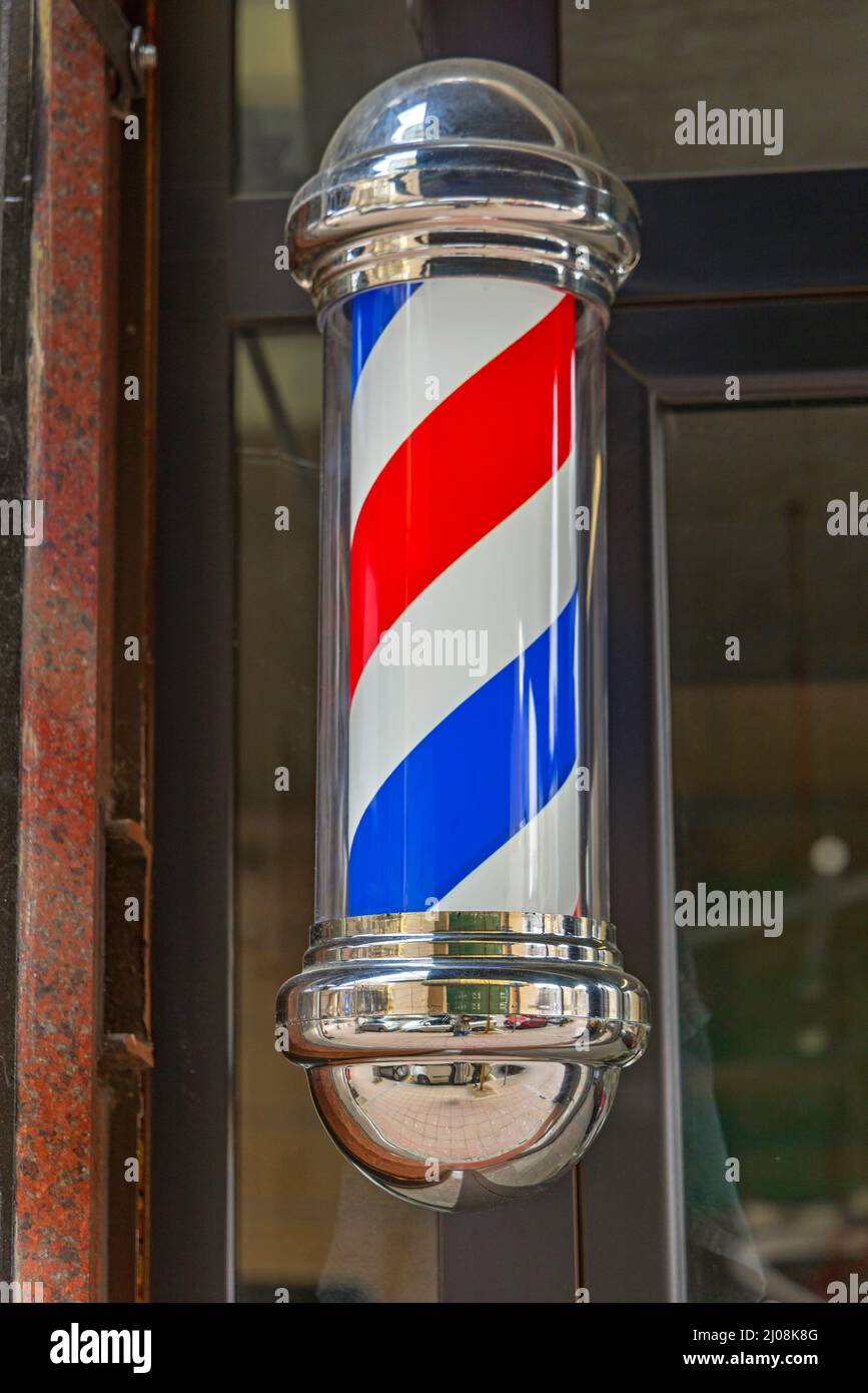 Barber Pole Retro Swirl Sign at Hairdresser Shop Stock Photo - Alamy