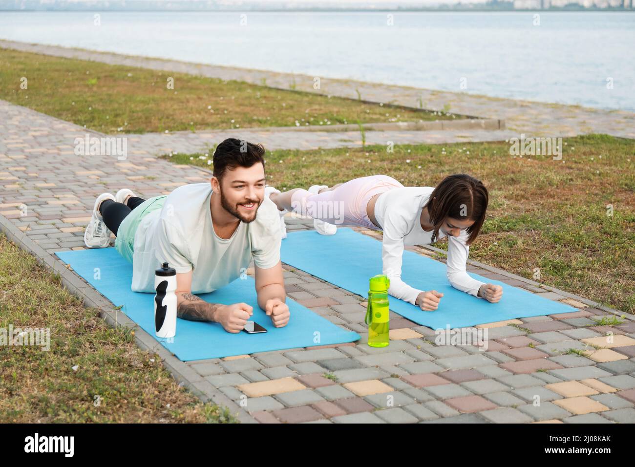 Portrait couple doing physical exercise hi-res stock photography and ...