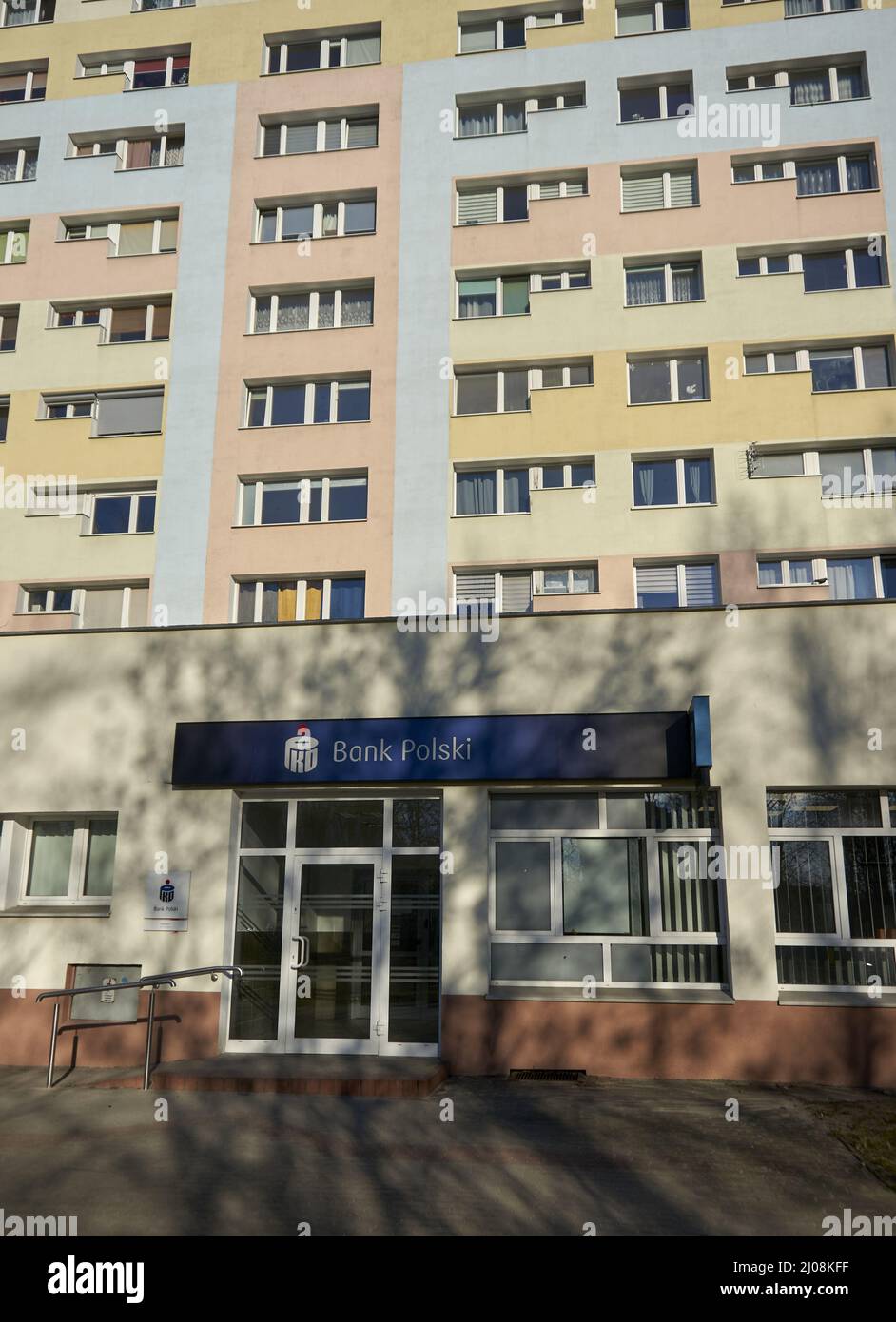 Front entrance of a PKO Bank Polish office by a high apartment building ...