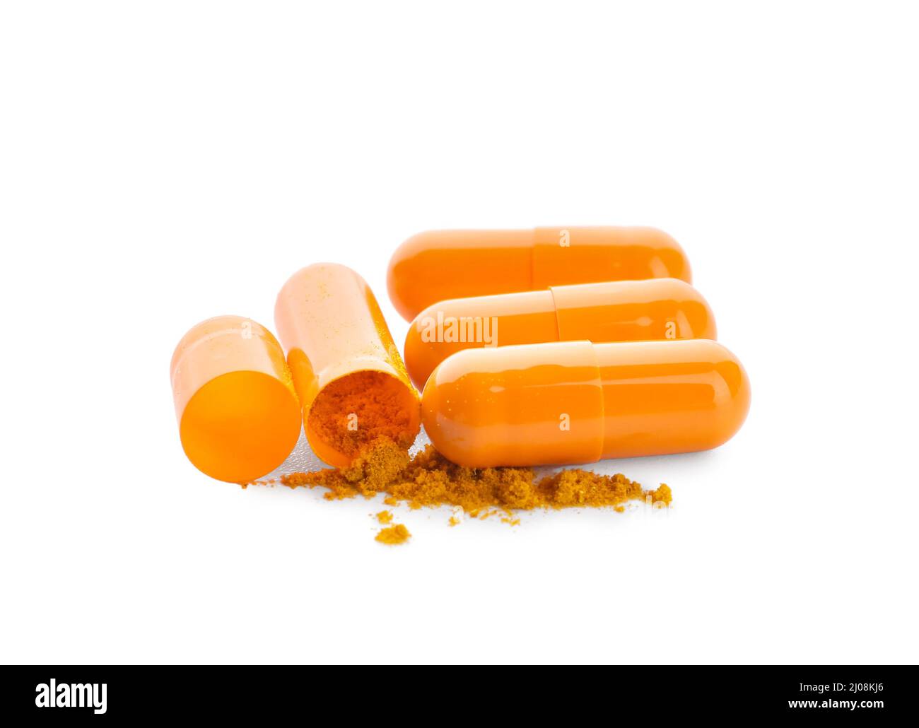 Turmeric powder capsules on white background Stock Photo - Alamy