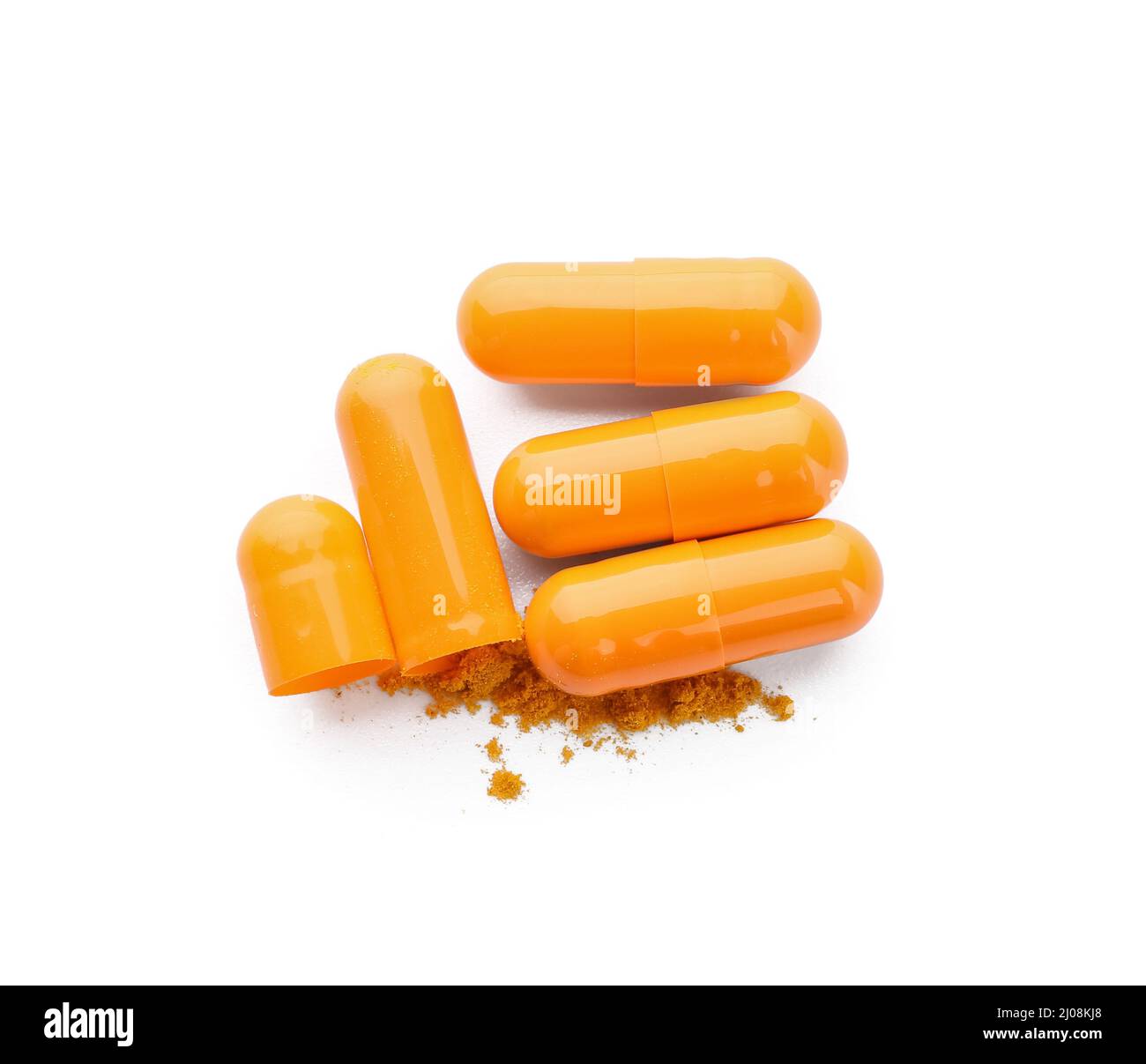 Turmeric powder capsules on white background Stock Photo - Alamy