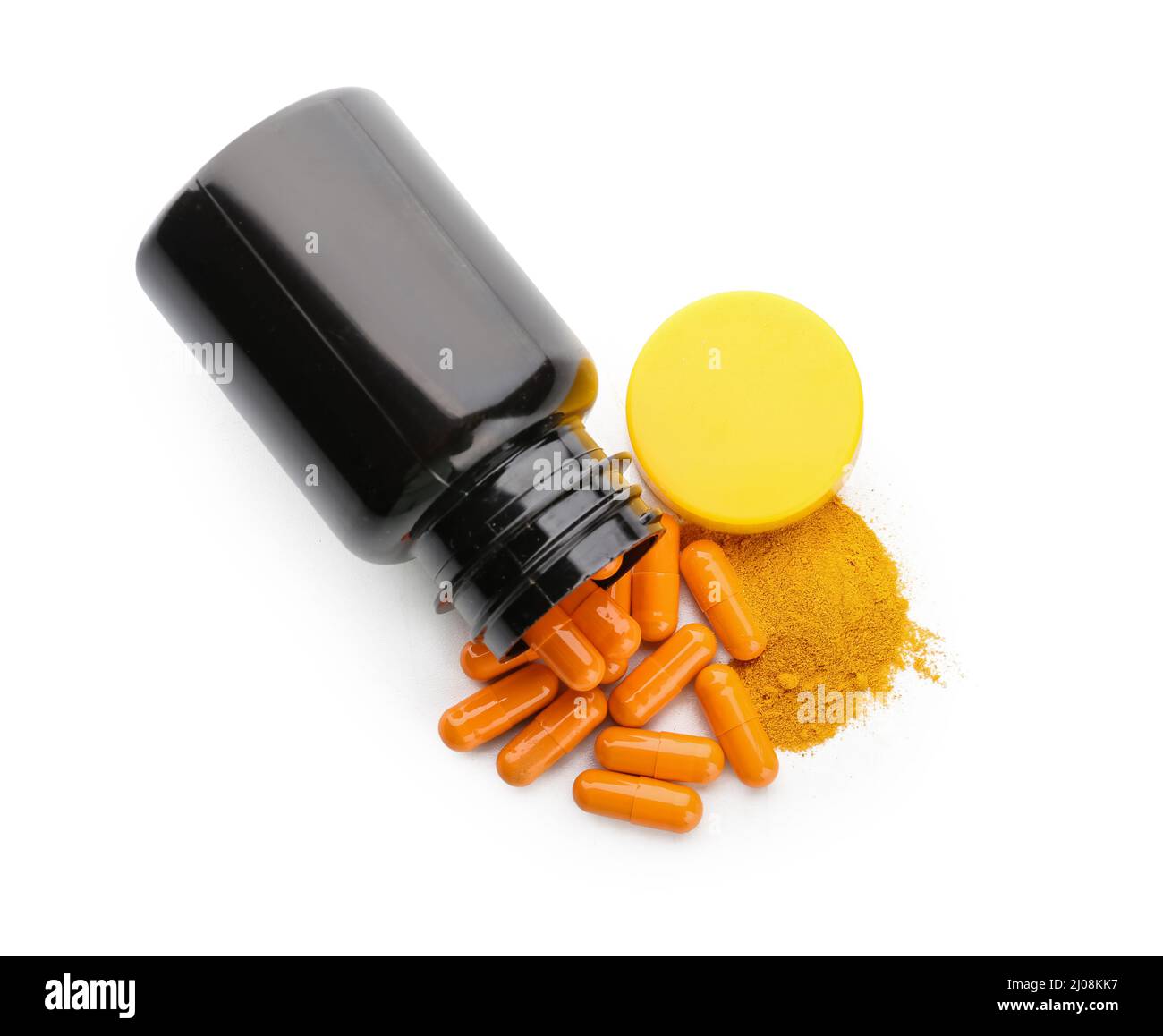 Bottle with turmeric powder capsules on white background Stock Photo ...