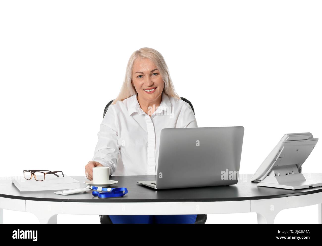 Mature secretary at table on white background Stock Photo - Alamy