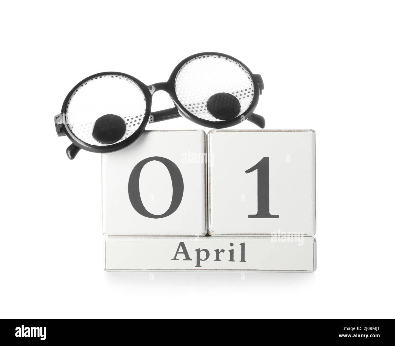 Cube calendar and eyeglasses on white background. April Fools Day ...