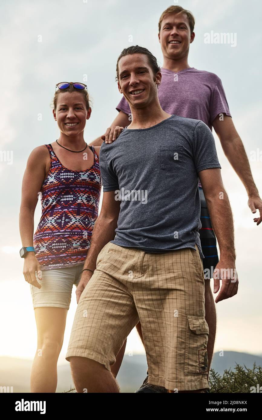 Finding happiness in hiking. Portrait of three happy friends posing ...