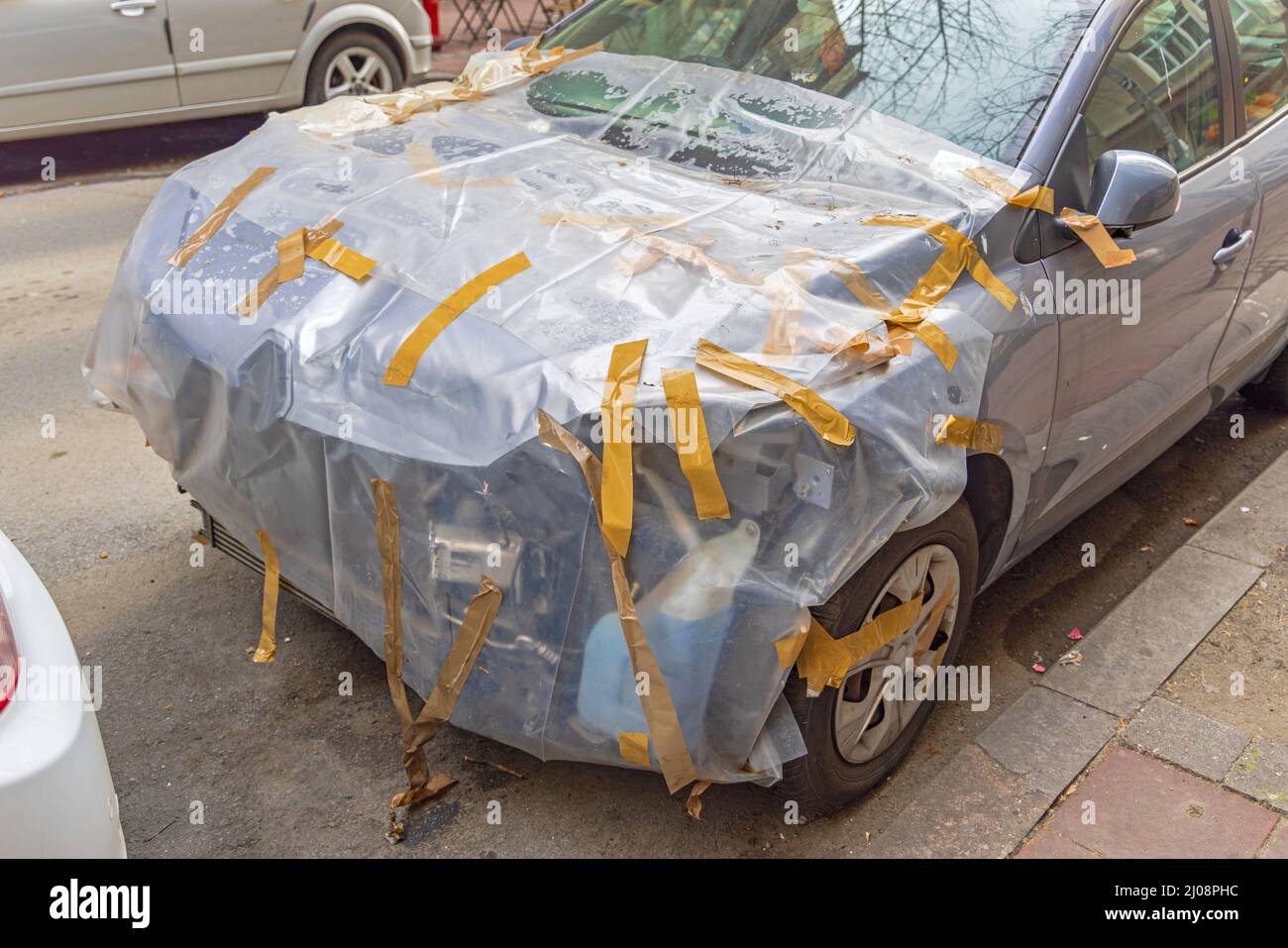 Car Front Traffic Accident Damage Covered With Plastic Foil Stock Photo ...
